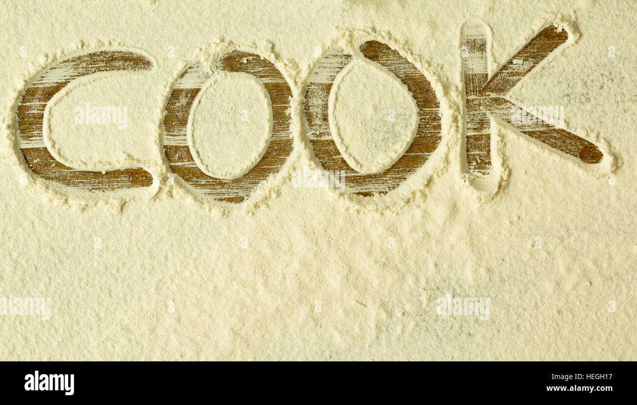 Flour on the table with writted word COOK Stock Photo - Alamy