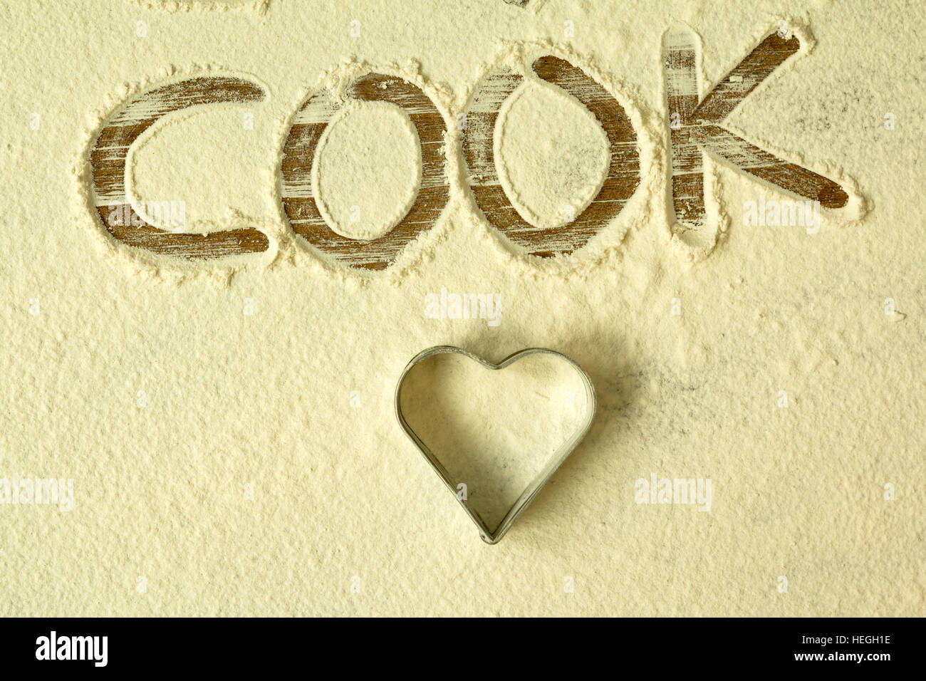 Flour on the table with writted word COOK Stock Photo - Alamy
