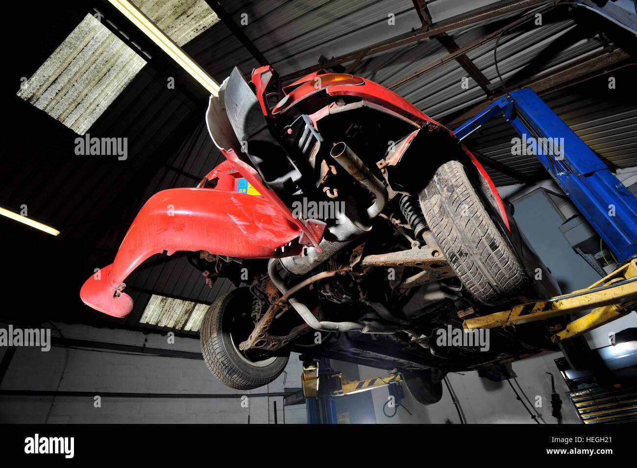 Car wreck. Crash damaged Mk1 Mazda MX5 with the rear bumper folded ...