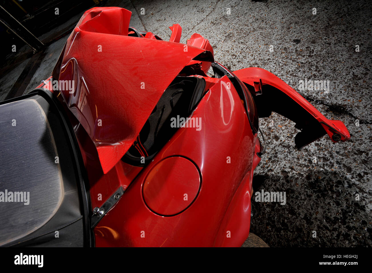 Car wreck. Crash damaged Mk1 Mazda MX5 with the rear bumper folded ...