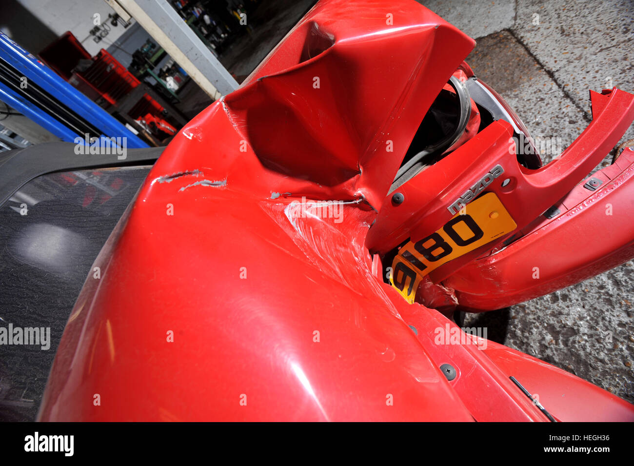 Car wreck. Crash damaged Mk1 Mazda MX5 with the rear bumper folded ...