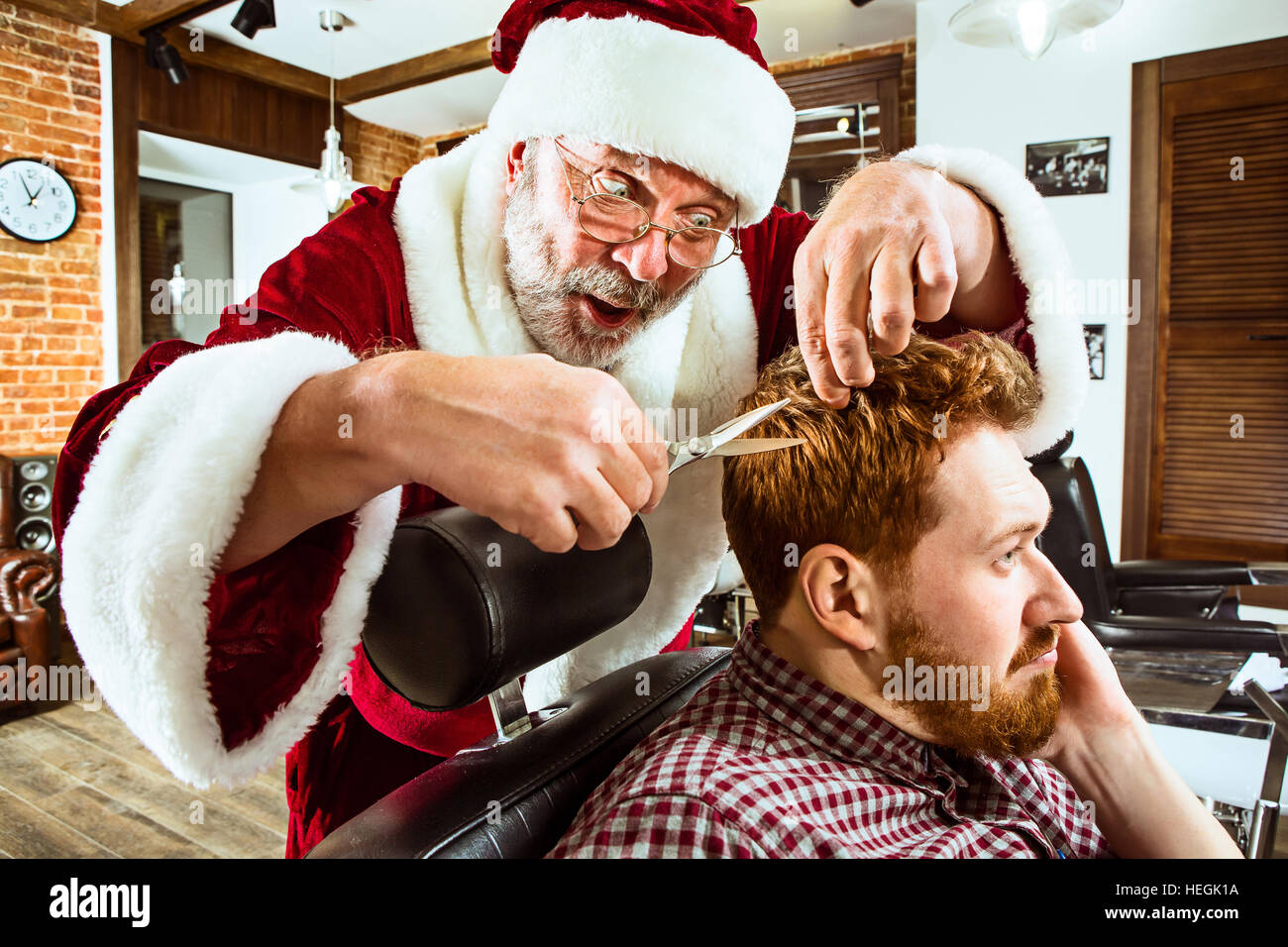 Santa claus as master at barber shop Stock Photo - Alamy