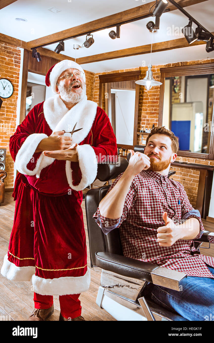 Santa claus as master at barber shop Stock Photo - Alamy