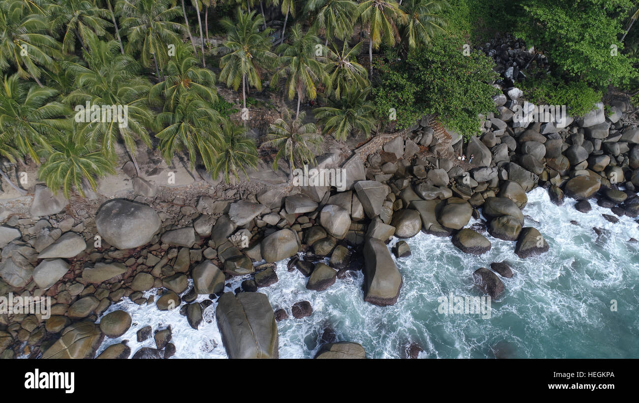 Aerial top view of sea waves hitting rocks on the beach in Phuket ...