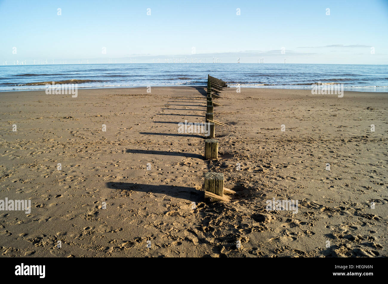 Wooden posts on the beach going into the sea Stock Photo - Alamy