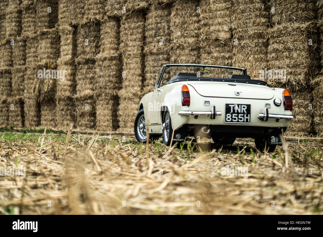 Rear of MG Midget parked in front of hay bails Stock Photo - Alamy