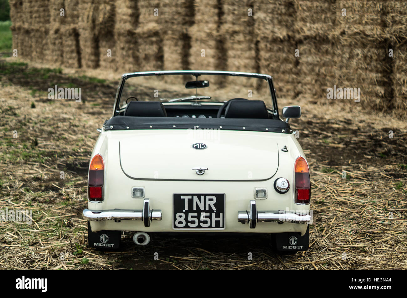 Rear of MG Midget parked in front of hay bails Stock Photo - Alamy