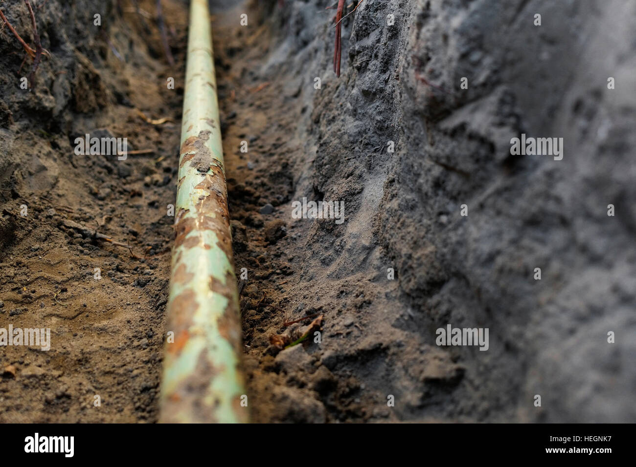 Detail of a residential gas pipe in a trench Stock Photo - Alamy