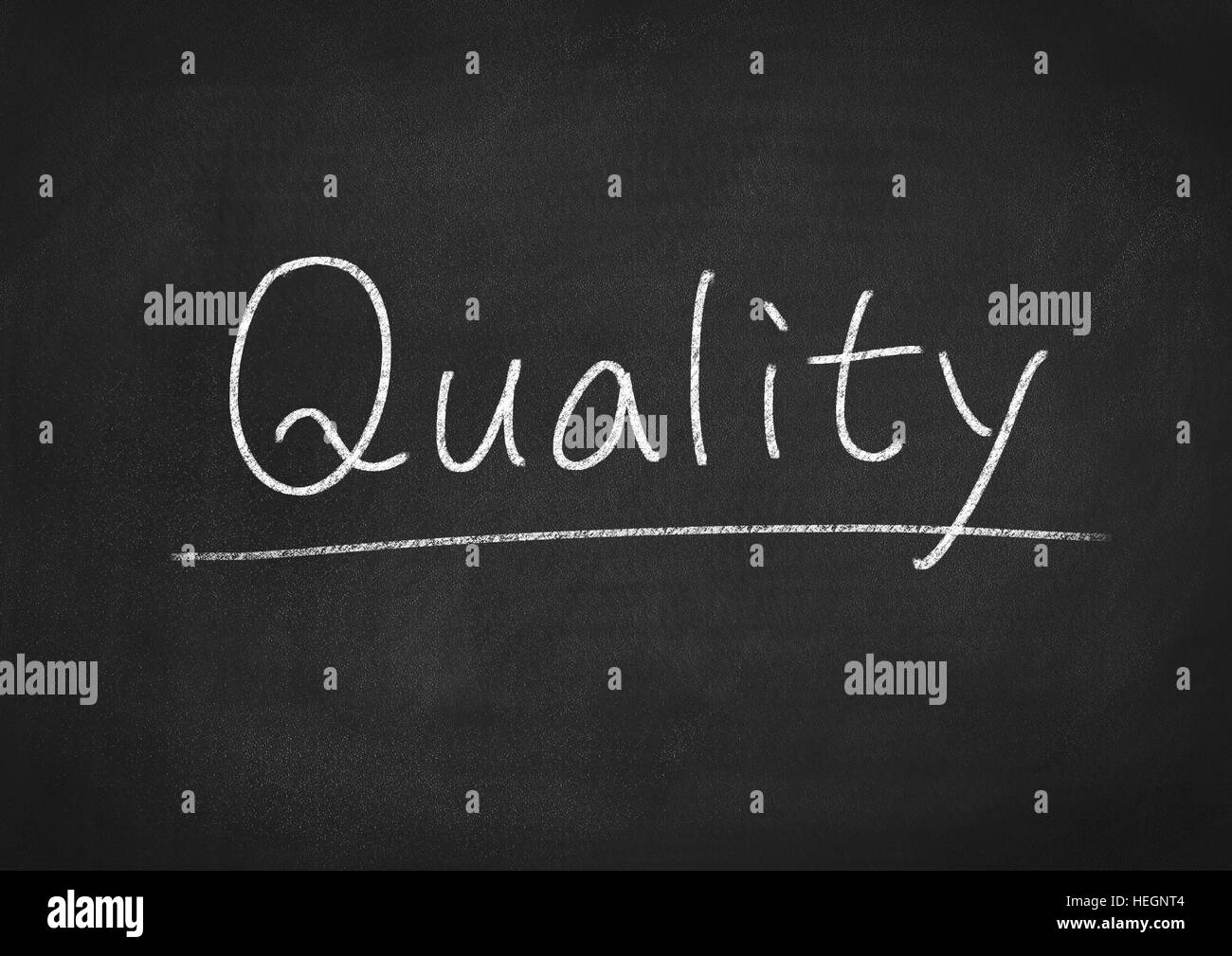 quality concept word on blackboard background Stock Photo - Alamy
