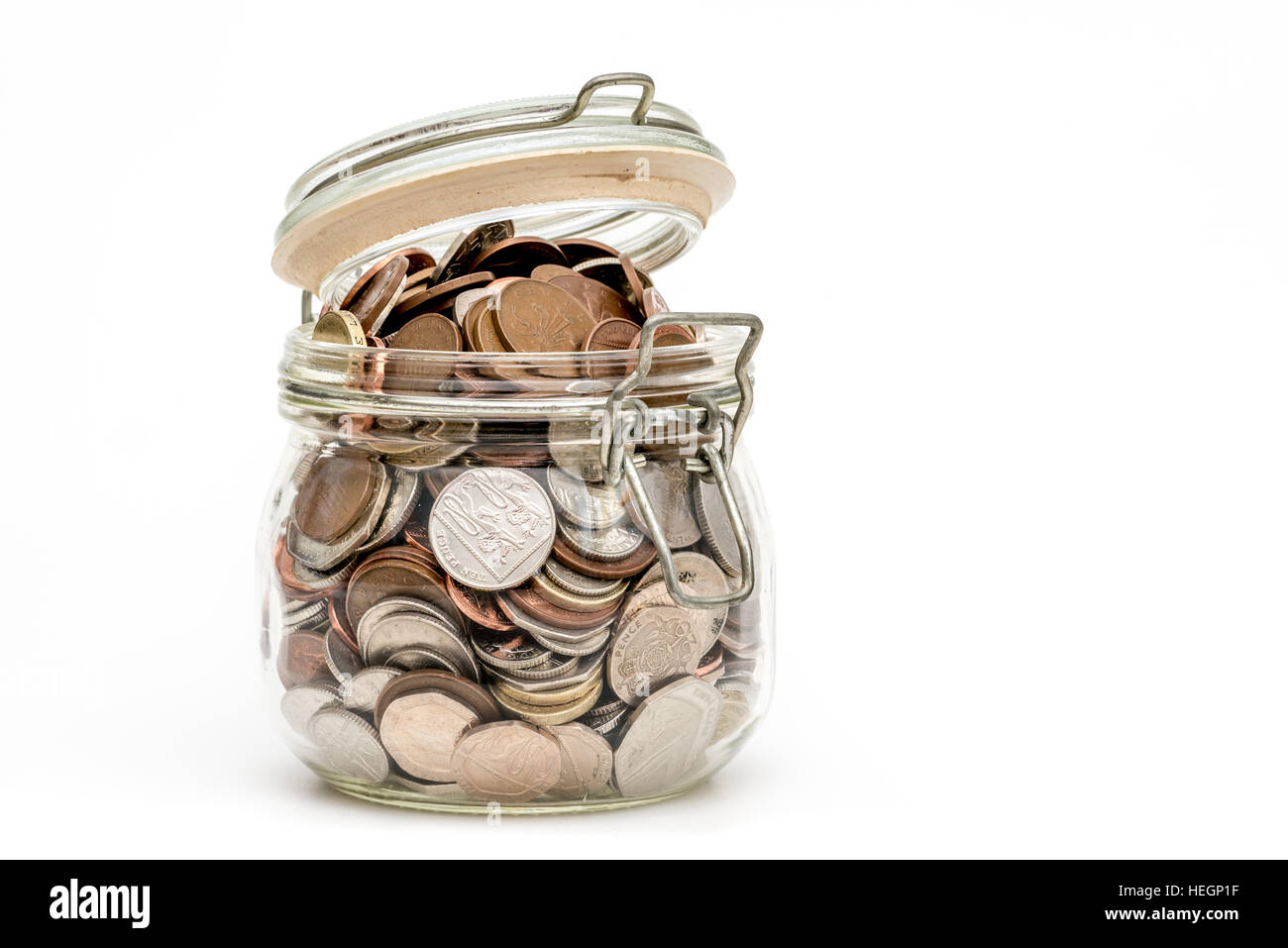Jar of British coins - isolated on white background Stock Photo - Alamy