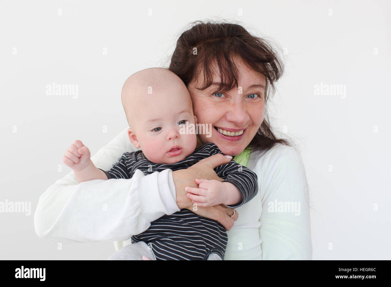 Grandmother hug her newborn grandson and smile Stock Photo - Alamy