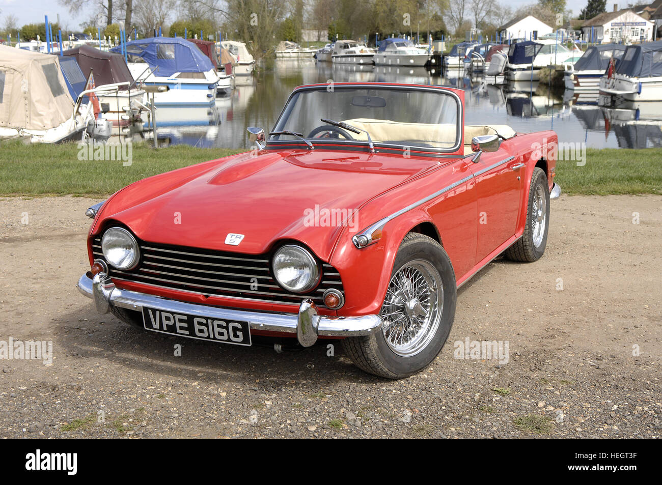 Convertible red Triumph TR5 in boat yard with top down Stock Photo - Alamy