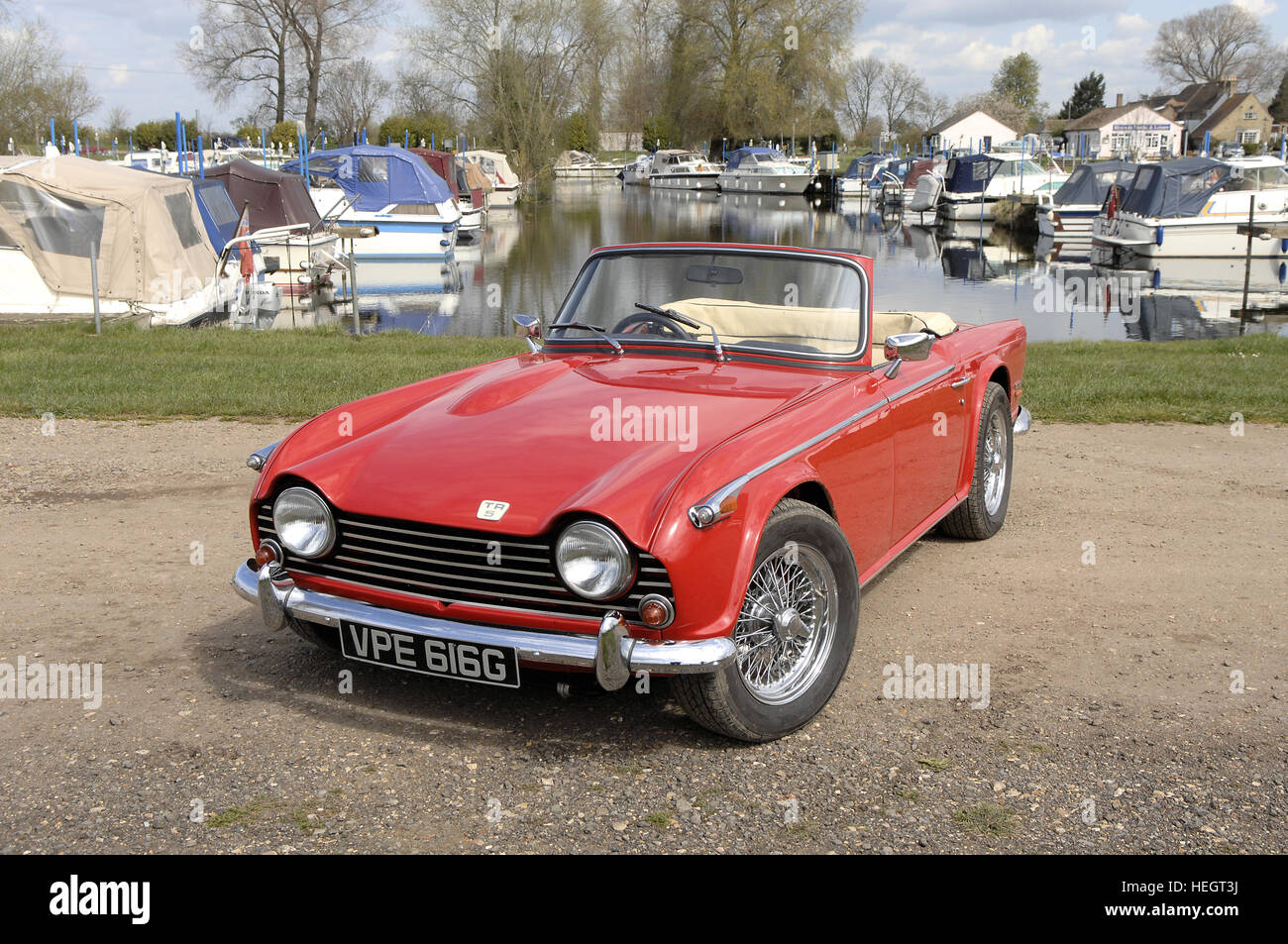 Convertible red Triumph TR5 in boat yard with top down Stock Photo - Alamy