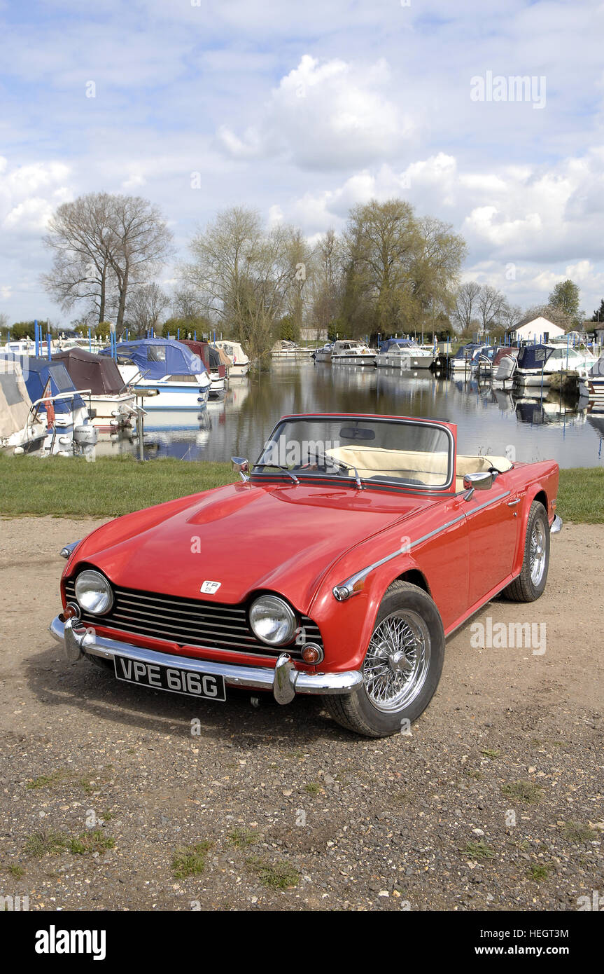 Convertible red Triumph TR5 in boat yard with top down Stock Photo - Alamy