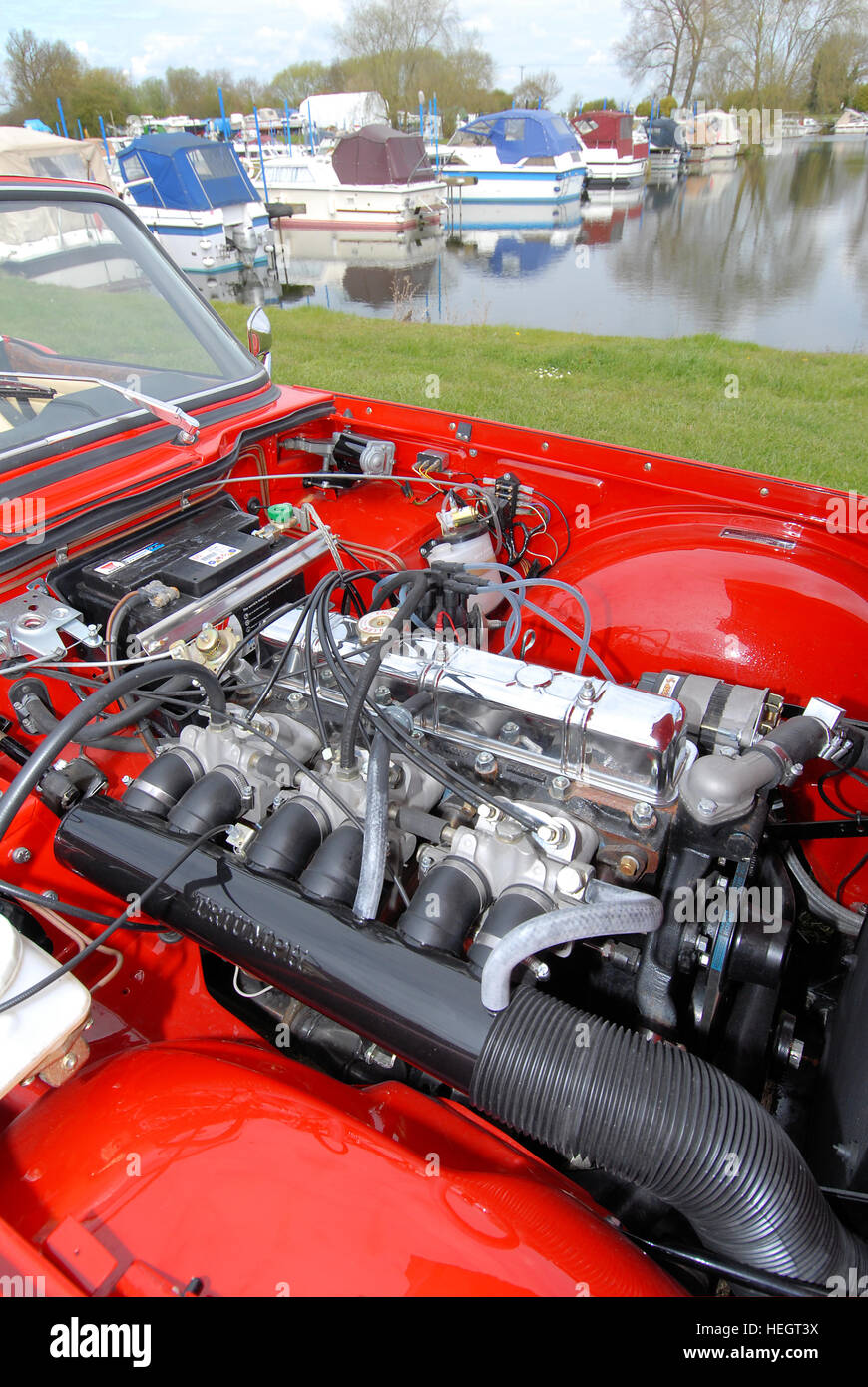 Convertible red Triumph TR5 engine with bonnet open Stock Photo - Alamy