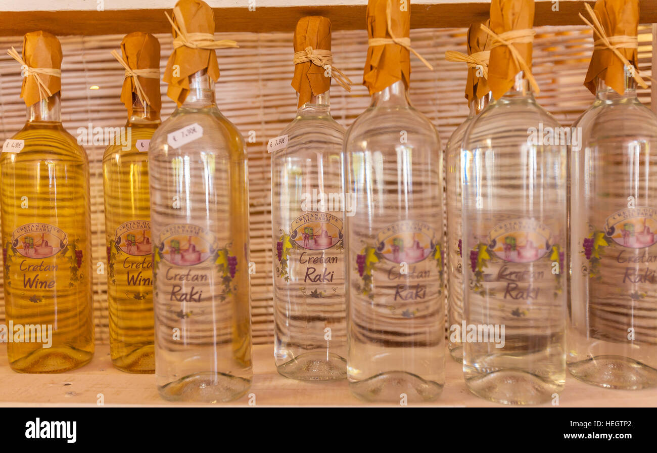 AGIOS NIKOLAOS, GREECE - JULY 29, 2012: Wine and brandy rakia of home ...