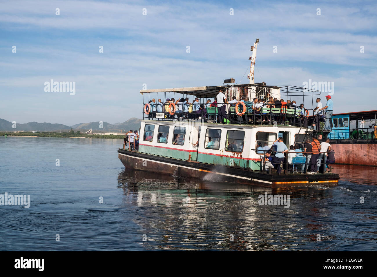 Early morning ferry picking up workers for the refinery on the other ...