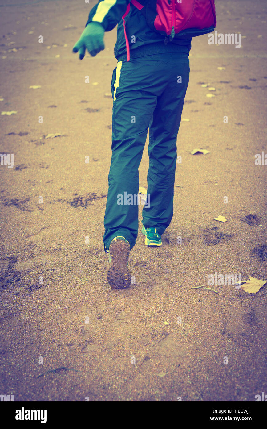 Man running away from danger. Showing danger behind Stock Photo - Alamy