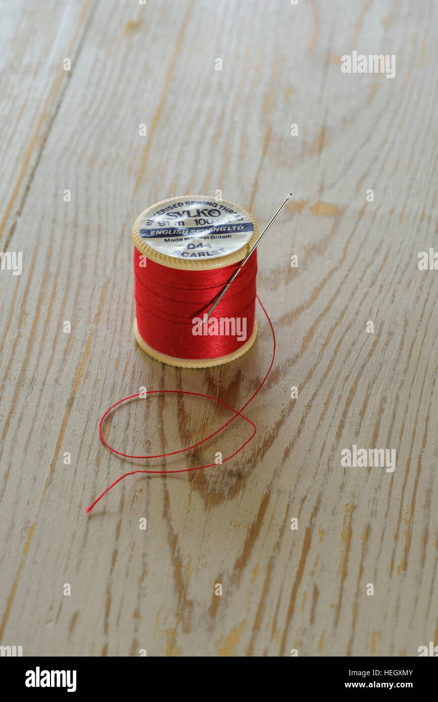 Cotton reel thread and sewing needle hi-res stock photography and ...
