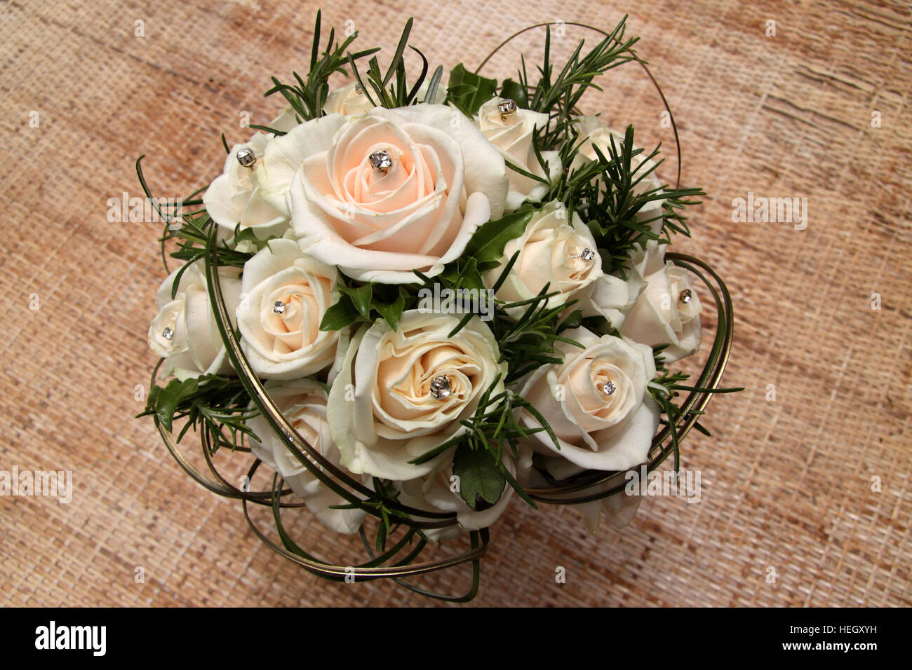 A wedding bouquet of white roses, with miniature gems set in the ...