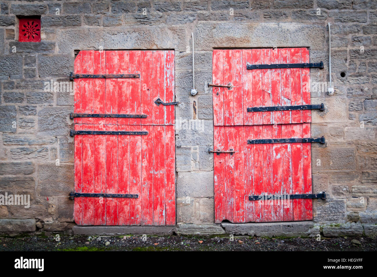 The red painted barn in Northumberland, abstract detail metalwork Stock ...