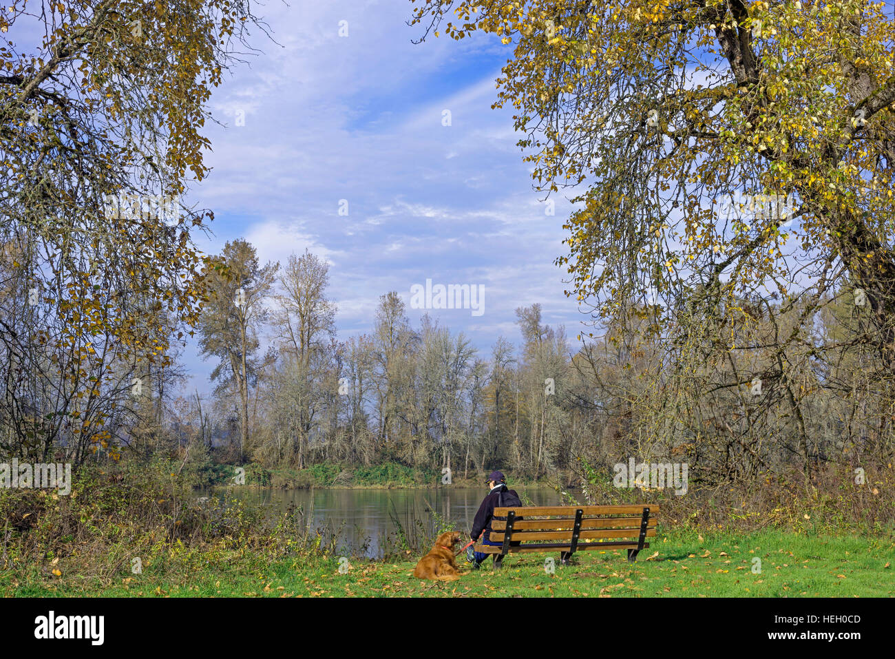 USA, Oregon, Willamette Mission State Park, Adult female and dog with ...