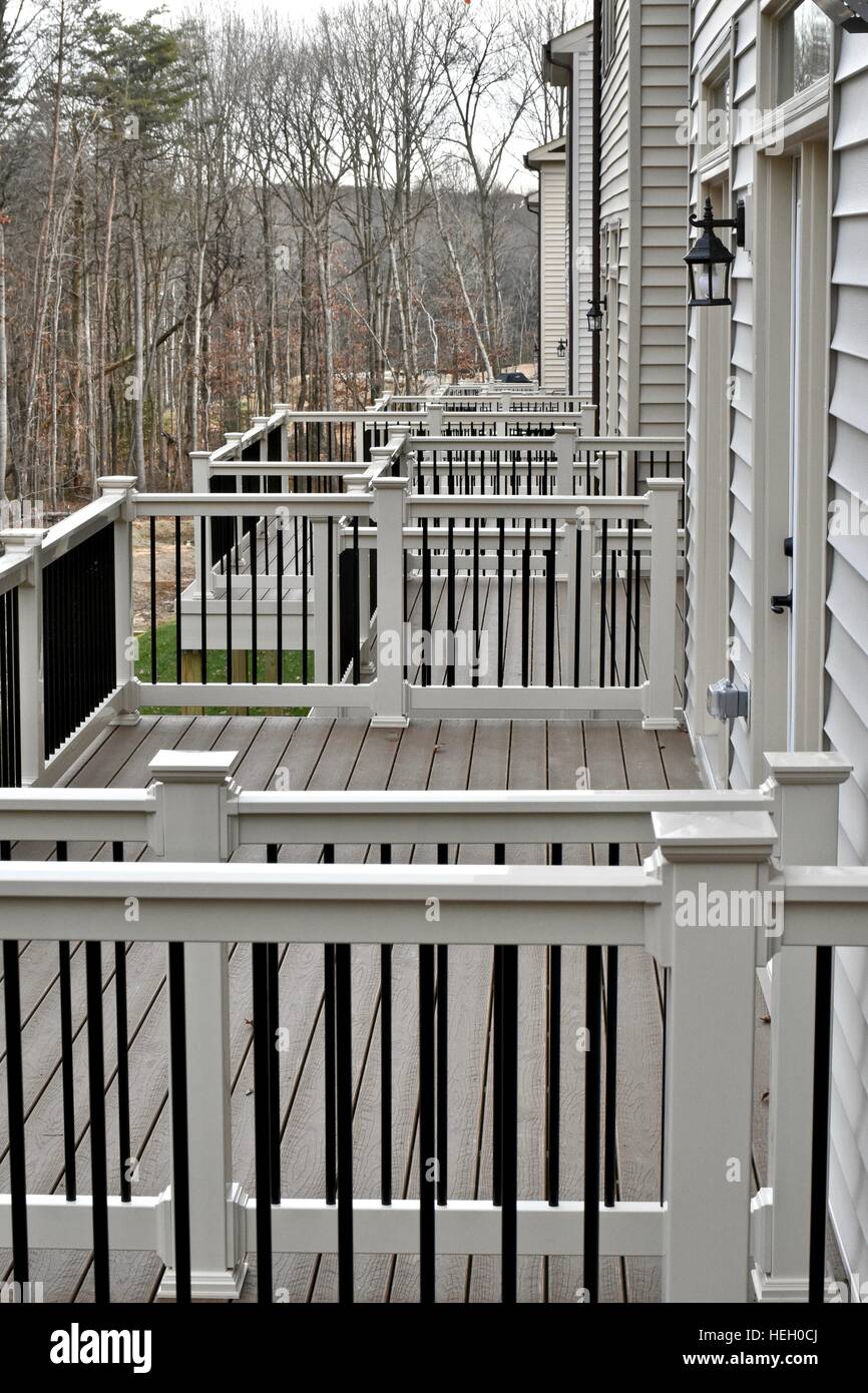 A wooded back yard area behind a row of town houses Stock Photo - Alamy
