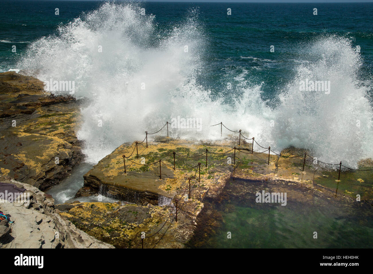 Waves crashing over the railing to the Bogie Hole Stock Photo - Alamy