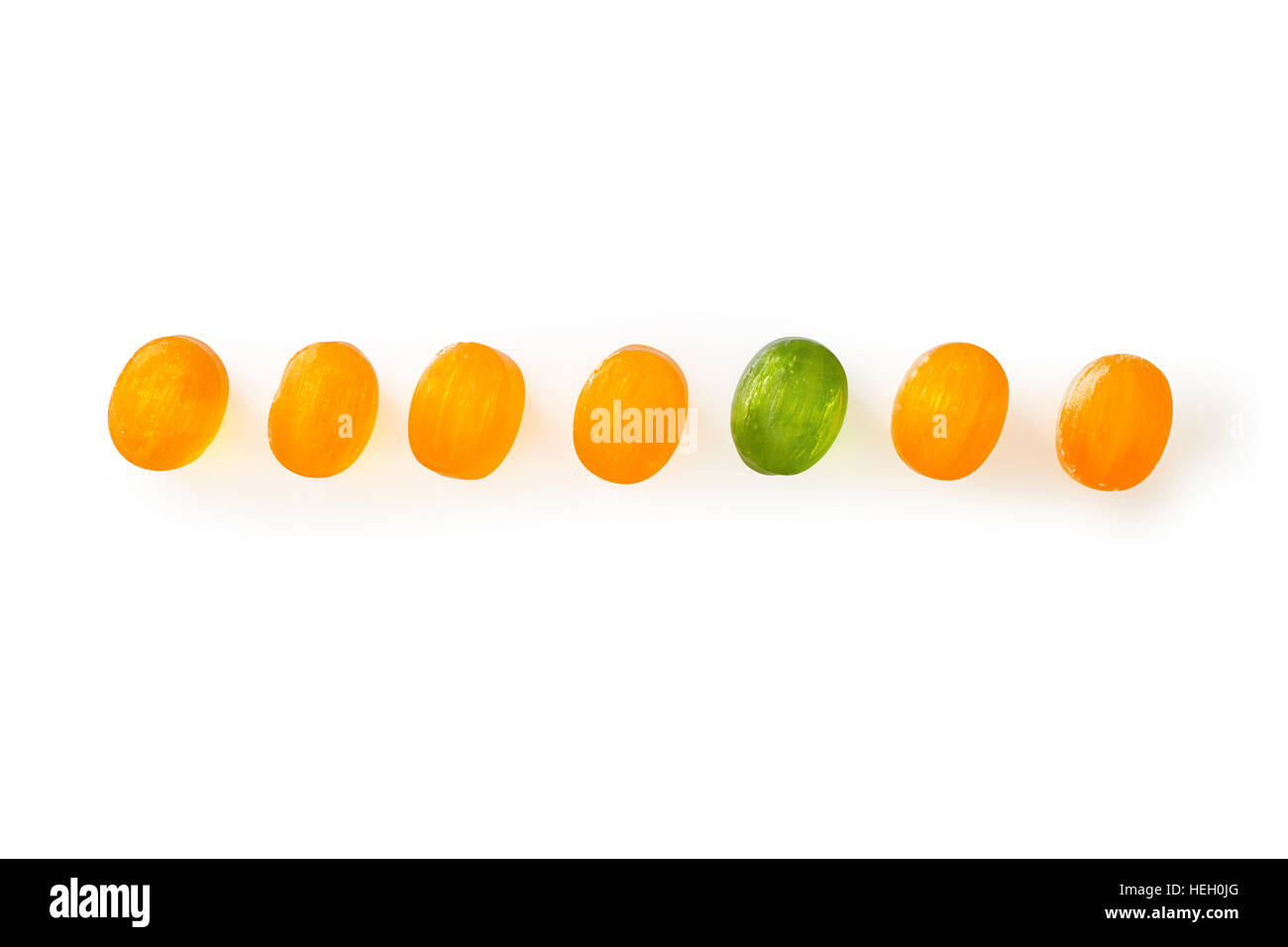 Row of small candies. Isolated on white with clipping path Stock Photo ...