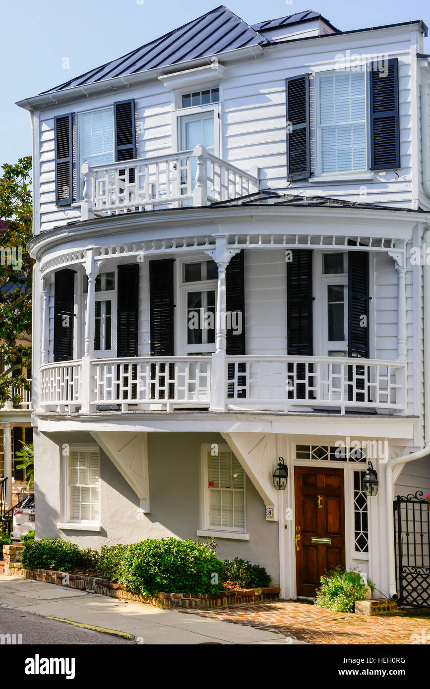 Beautiful wooden colonial home with balconies and shutters near the ...