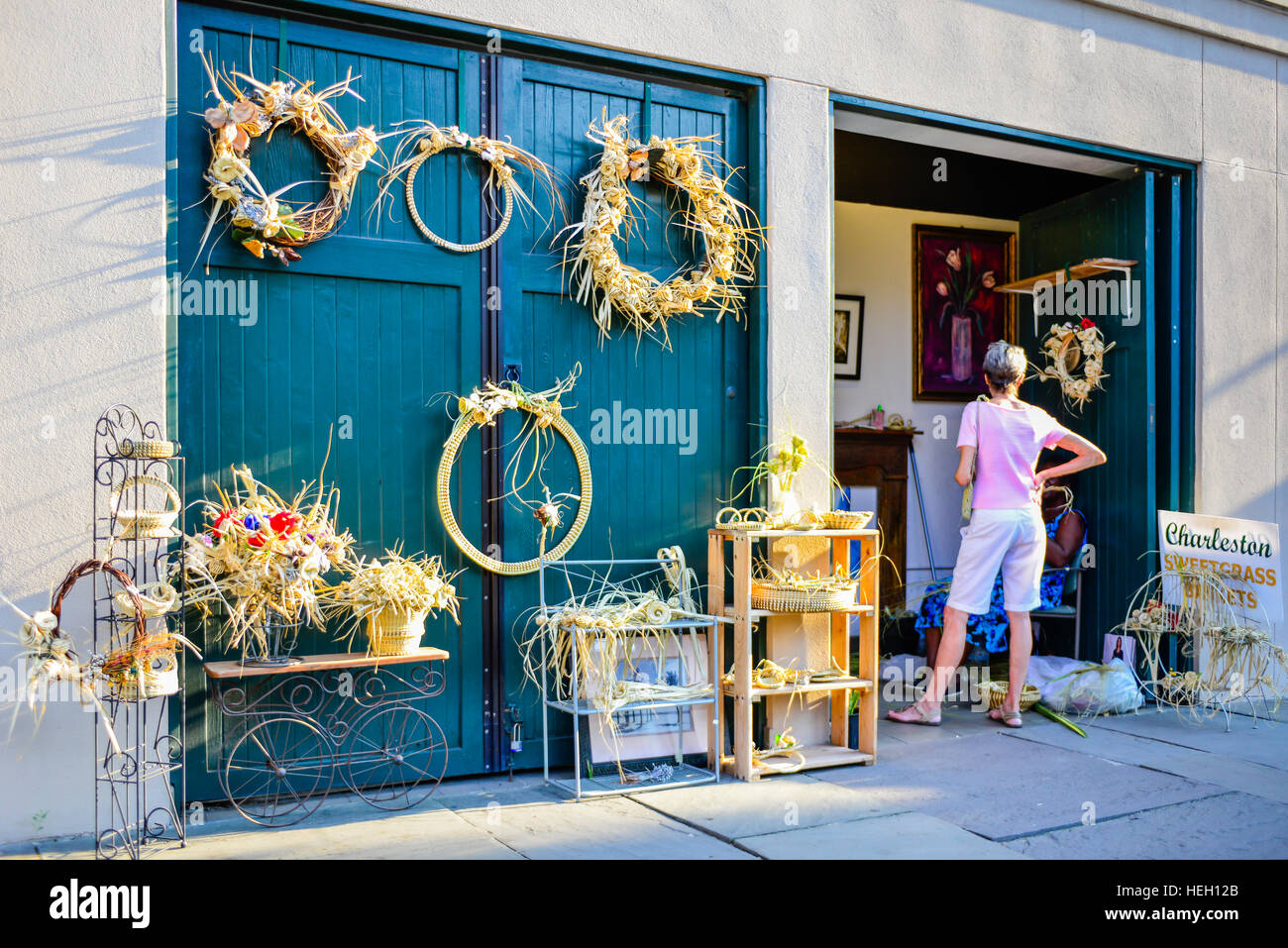 Seagrass wreaths and crafts for sell are displayed by artist outside on ...