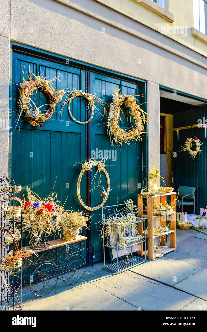 Seagrass wreaths and sea grass crafts on display by artist outside on ...