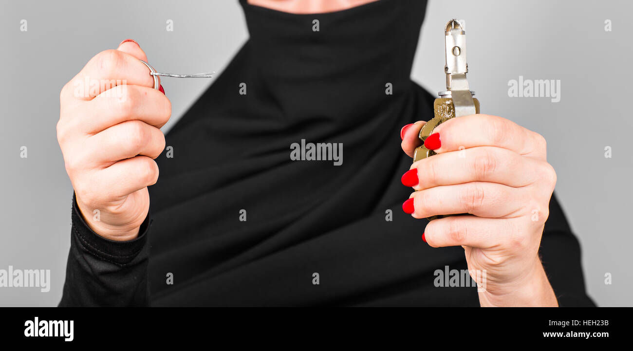 Hand grenade in a woman's hand with the pin pulled Stock Photo - Alamy