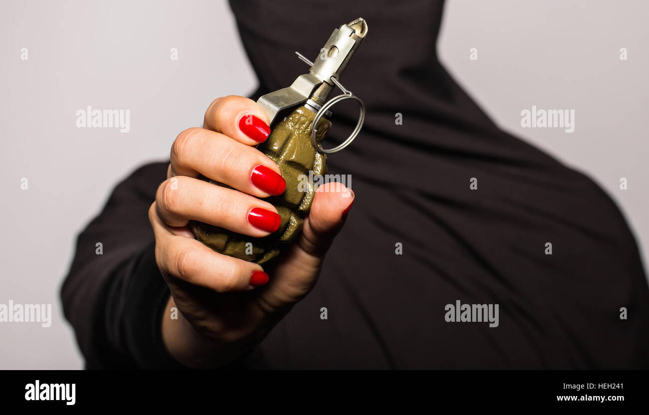 Hand grenade in a woman's hand Stock Photo - Alamy