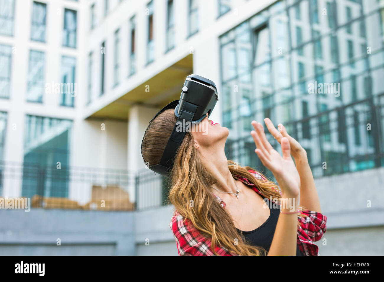 Woman with virtual reality goggles in the city Stock Photo - Alamy