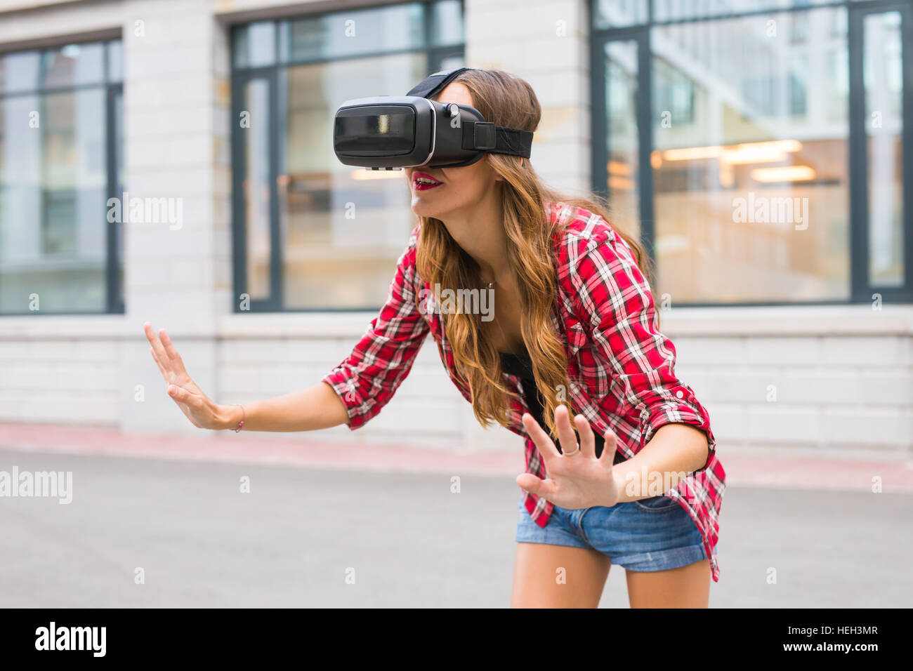 Young Beautiful Woman Using VR Outside Stock Photo - Alamy