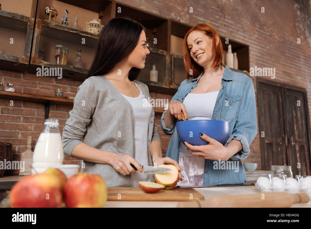 Amazing female smiling to one another Stock Photo - Alamy
