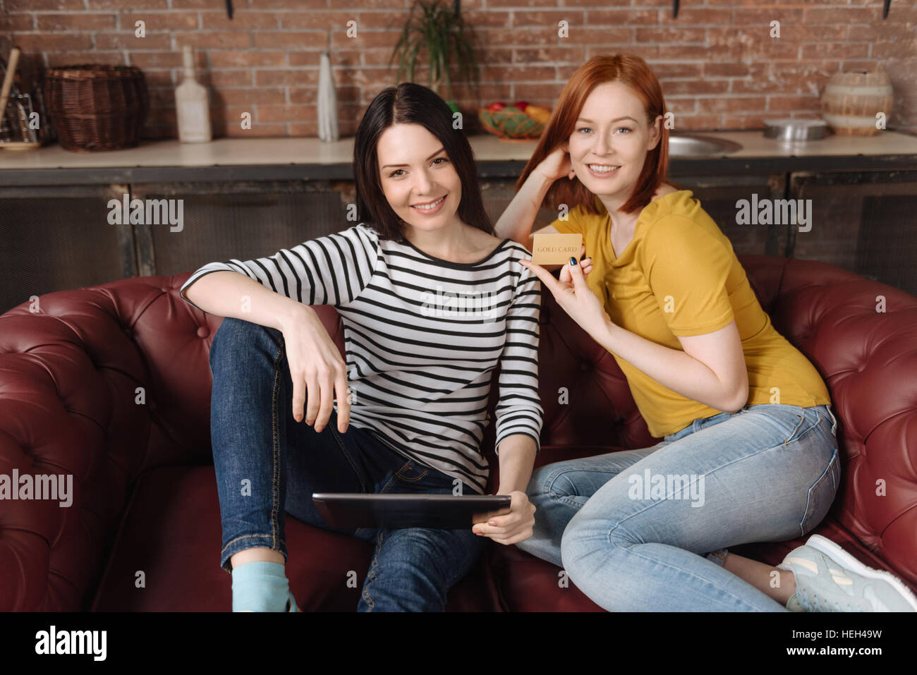 Cheerful friends relaxing while break Stock Photo - Alamy