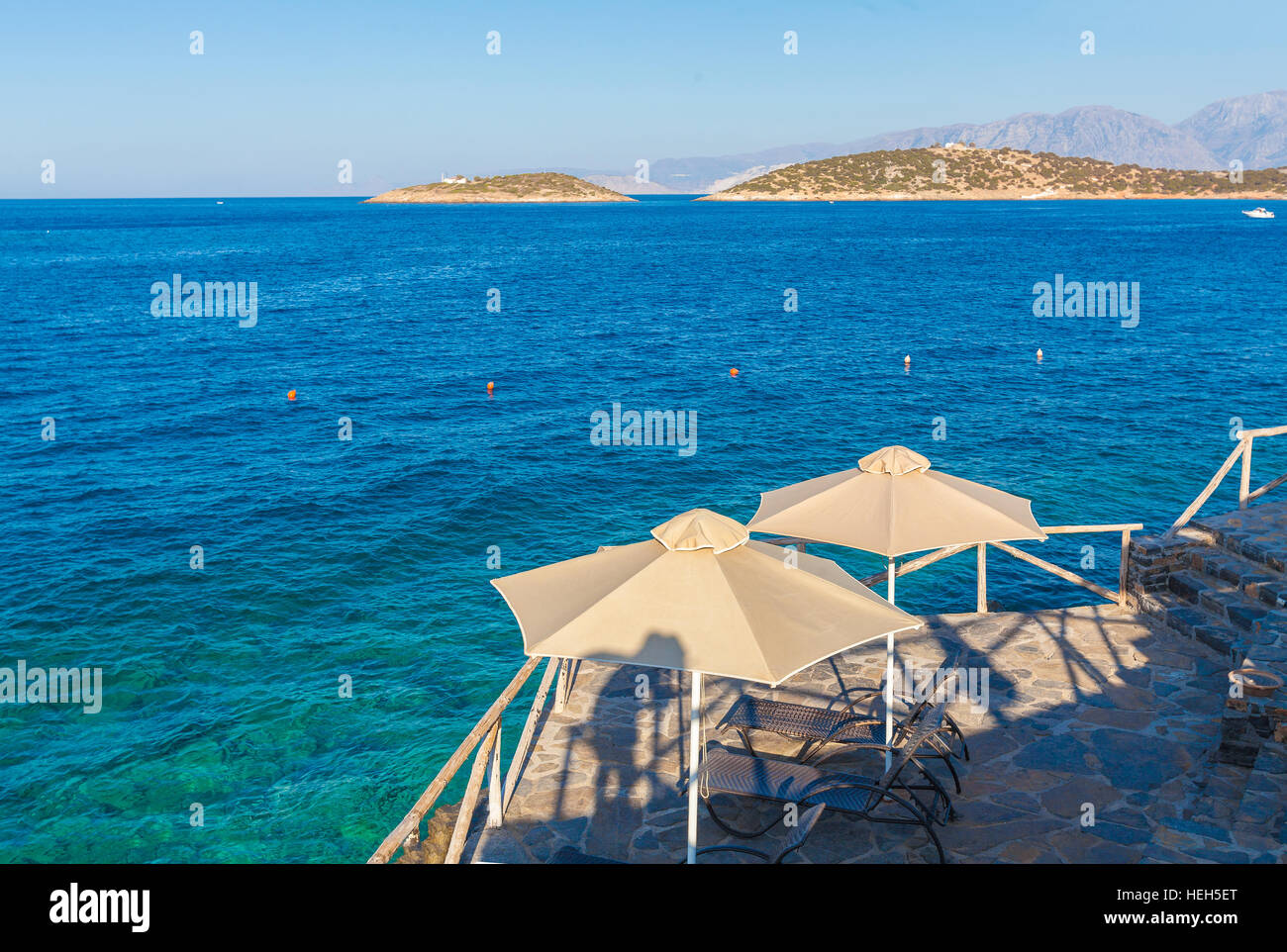 The beach on the coast of the Mediterranean sea with parasols and ...