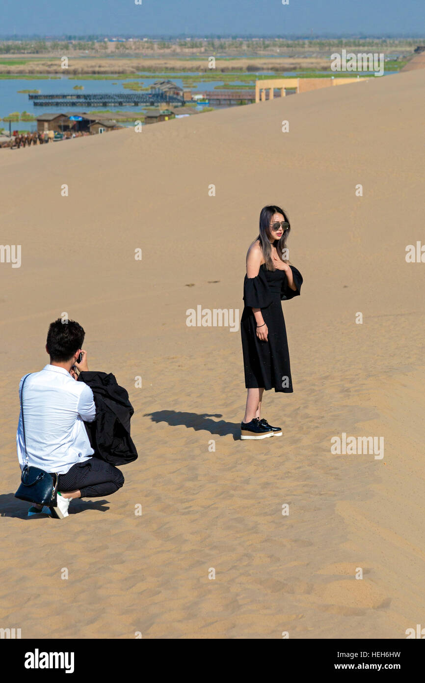 Chinese girl posing in the desert at Sand,Lake, Shizuishan, Ningxia ...
