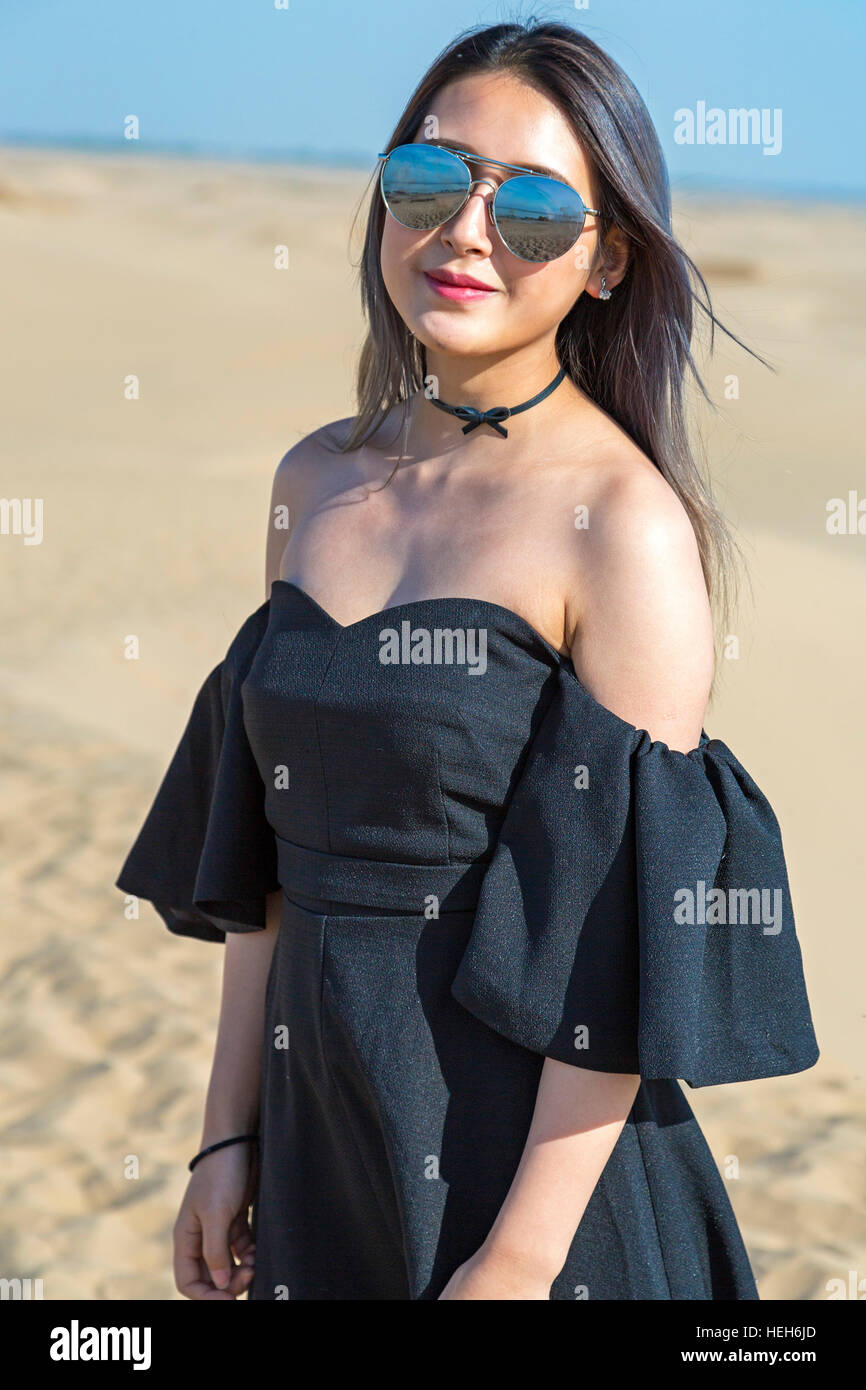 Chinese Girl Posing In The Desert At Sand Lake Shizuishan Ningxia