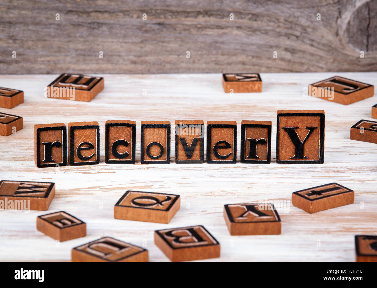 Recovery from wooden letters on wooden background Stock Photo - Alamy