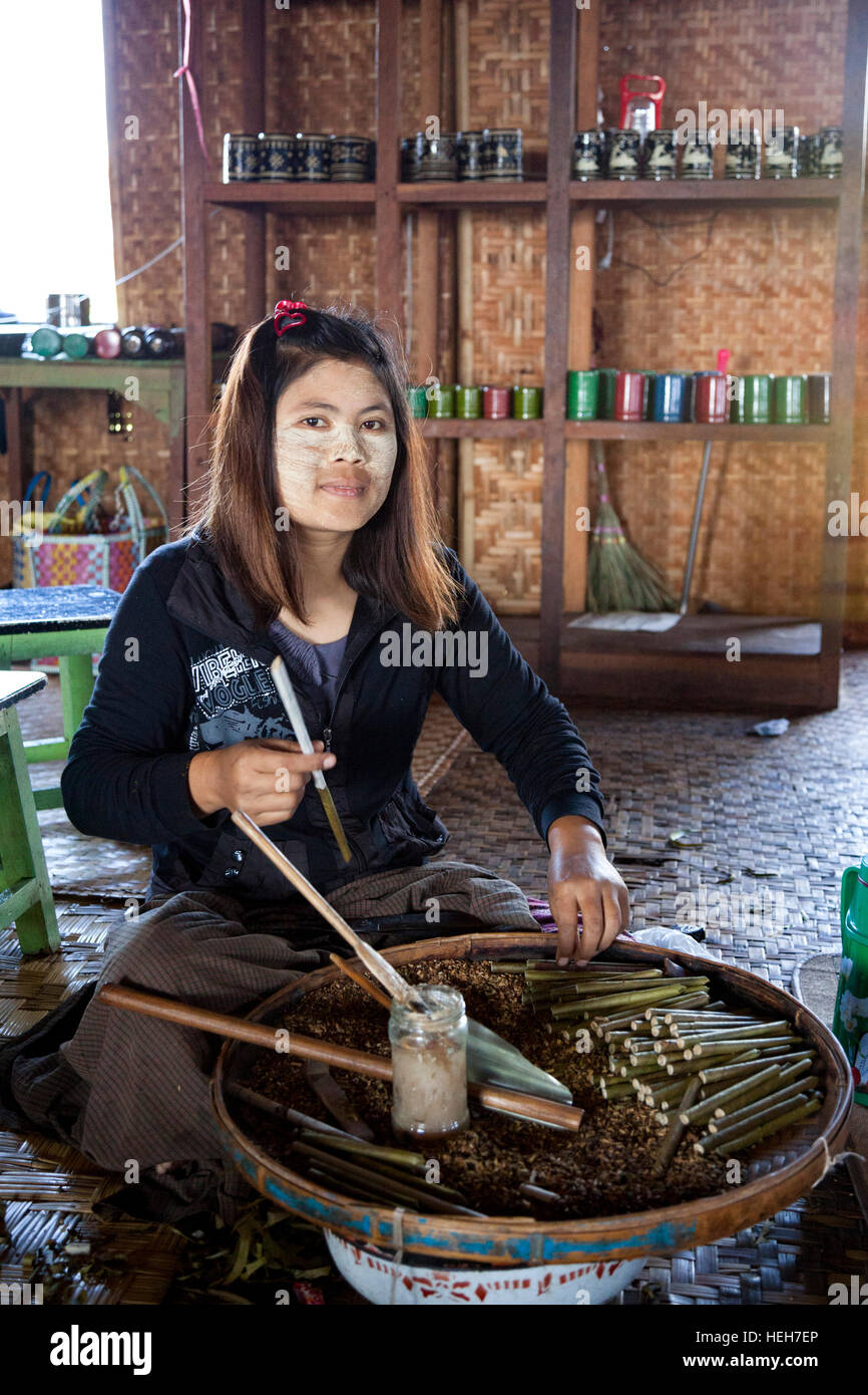 In a house of Lake Inle (Myanmar),a young female cigarette manufacturer ...