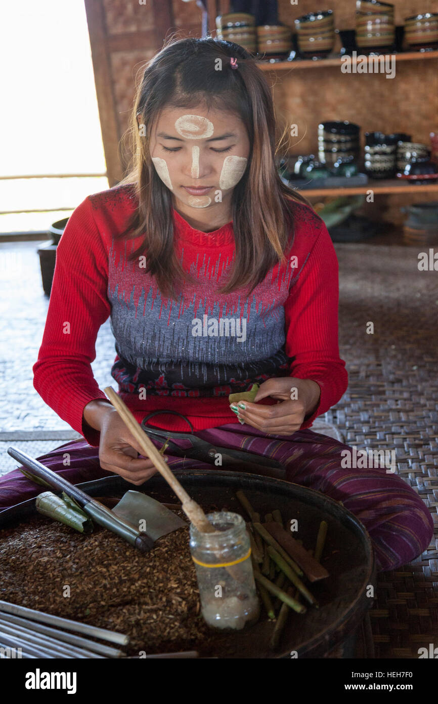 In a house of Lake Inle (Myanmar),a young female cigarette manufacturer ...