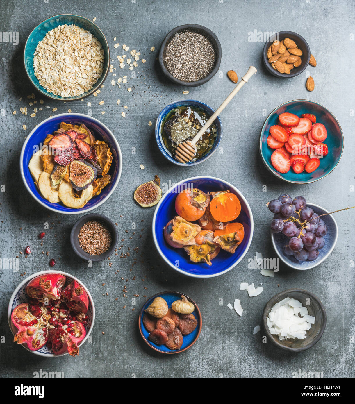 Ingredients for healthy breakfast over grey stone background, top view ...