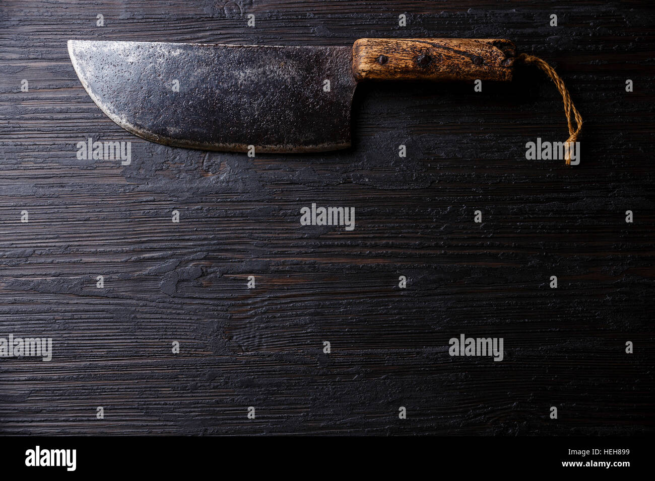Vintage Butcher meat cleaver knife on dark burned wooden background ...