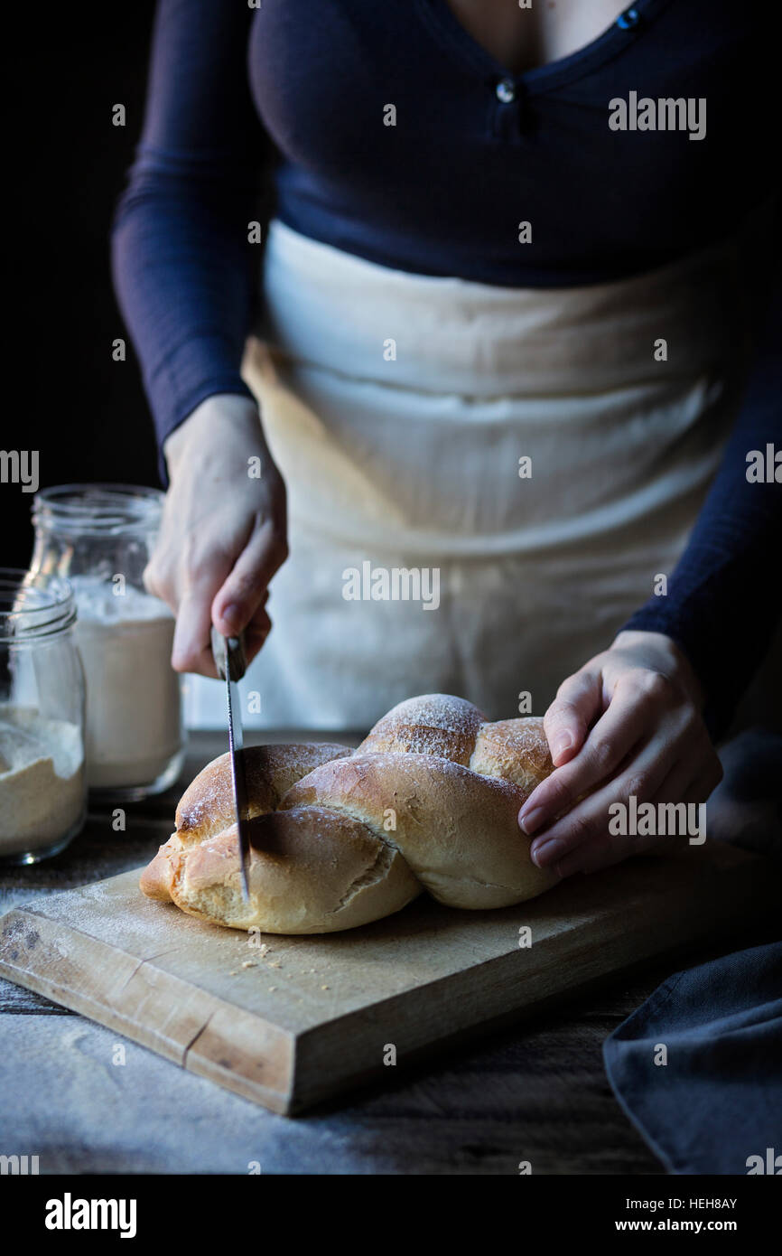 Bread woman cutting hi-res stock photography and images - Alamy