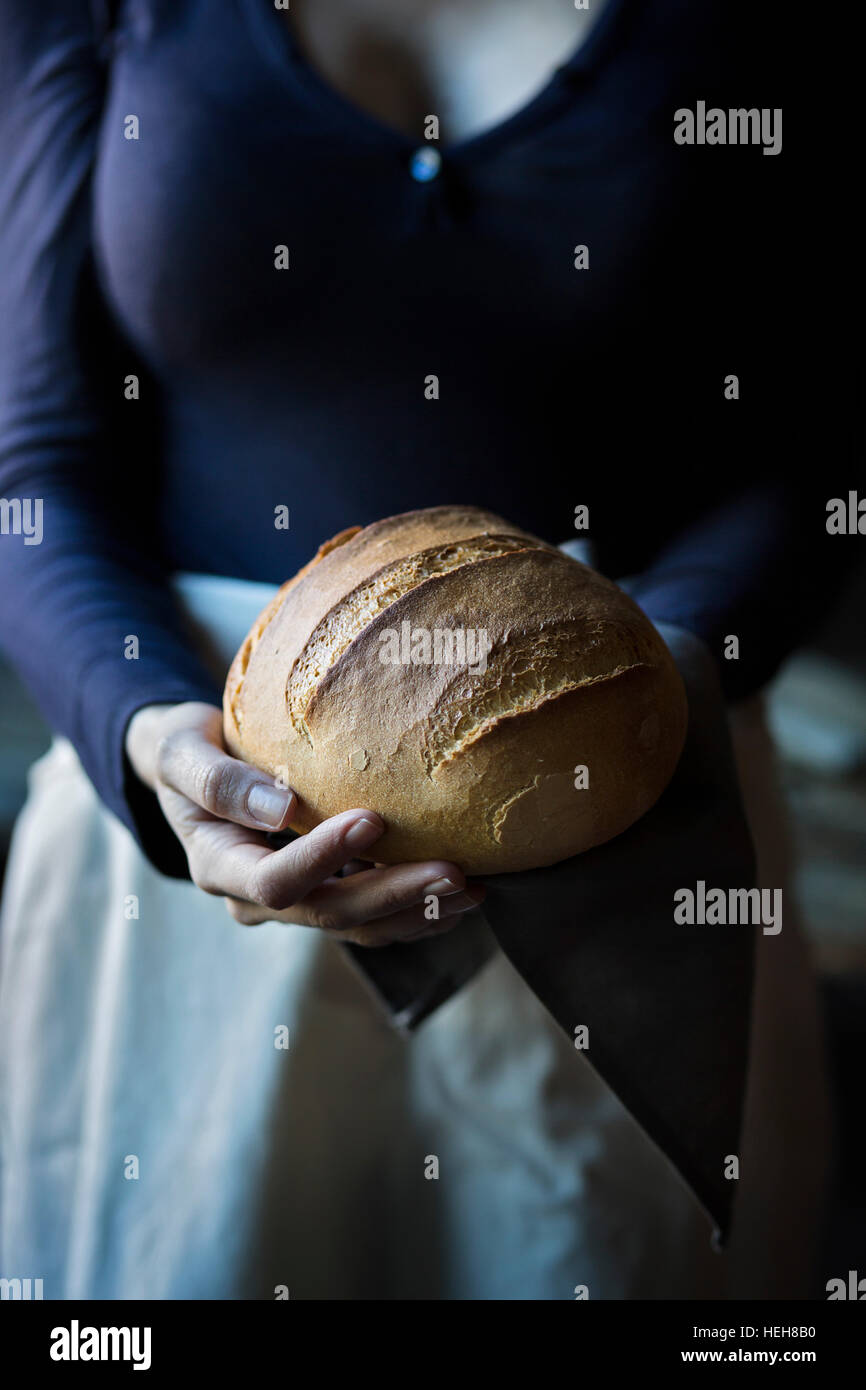 Woman cutting homemade bread hi-res stock photography and images - Alamy
