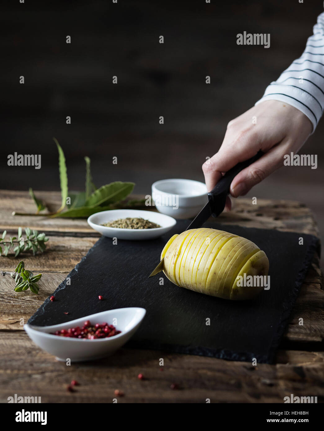 Cutting hasselback potato hi-res stock photography and images - Alamy
