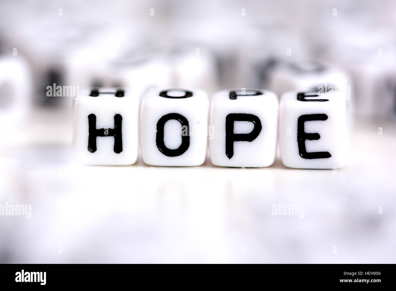 Hope word made from plastic alphabet blocks, stands in white background ...